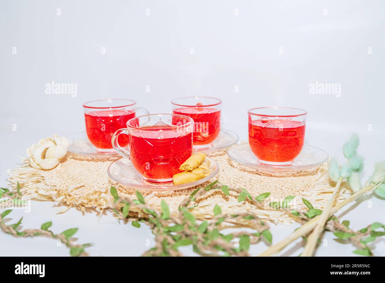 This clear glass cup allows you to appreciate the vibrant red color of ...
