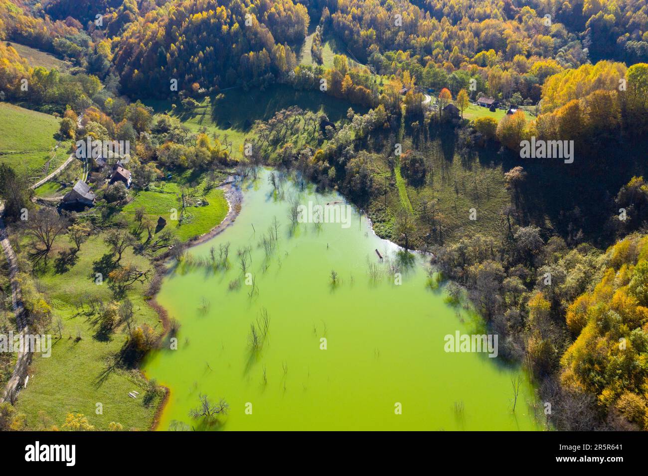 Aerial view of green mine waters from a copper mine flooding natural ...