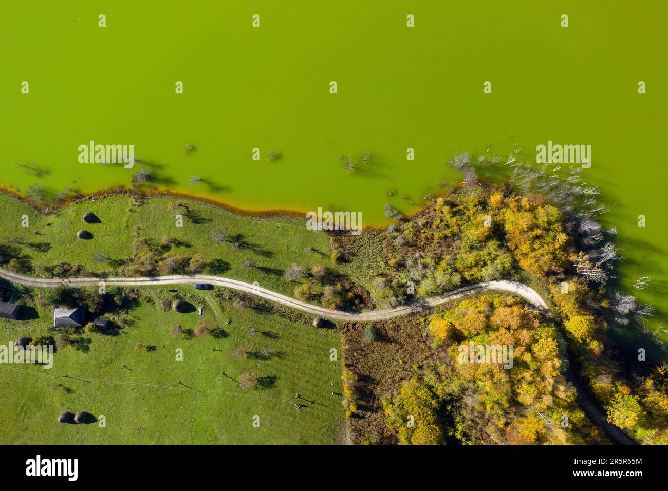 Aerial view of green mine waters from a copper mine flooding natural ...