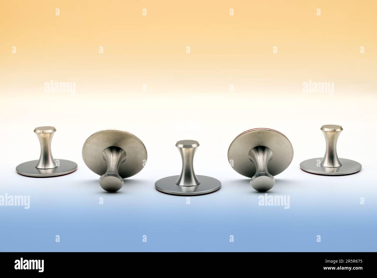 Adhesive holders in stainless steel. Self adhesive hooks Stock Photo ...