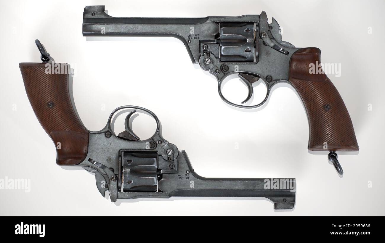 A top view of two guns displayed on a white background Stock Photo - Alamy