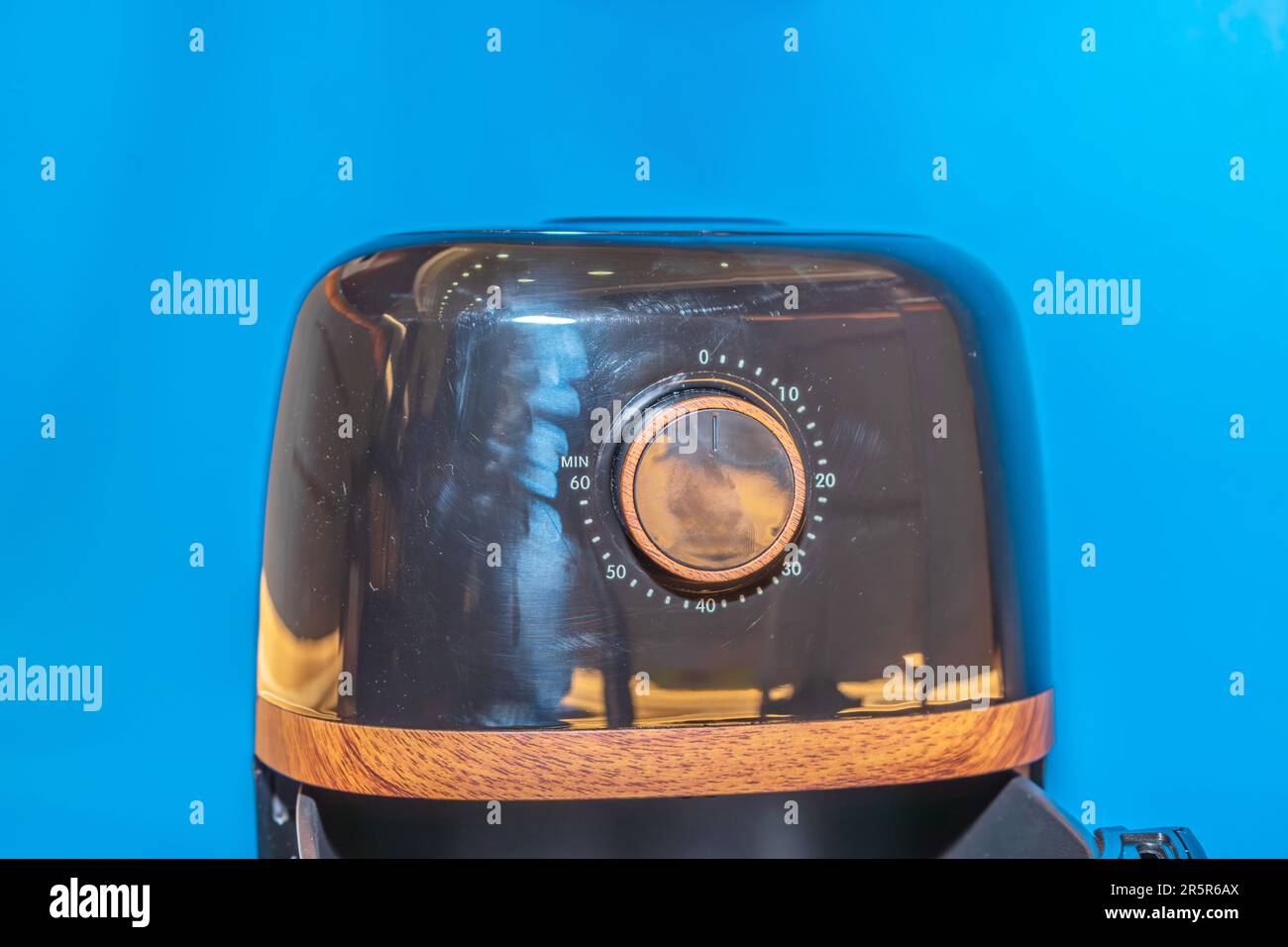 The Black Air Fryer with Wooden Handle Design offers a combination of ...