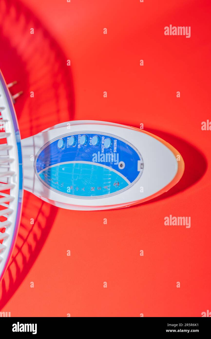 The Blue and White Wall-Mounted Fan is a versatile and practical ...