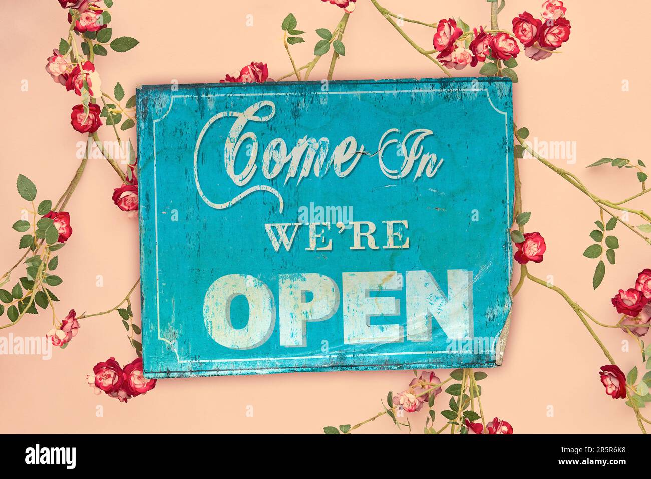 Come in we are open sign on a background with blooming red roses Stock ...