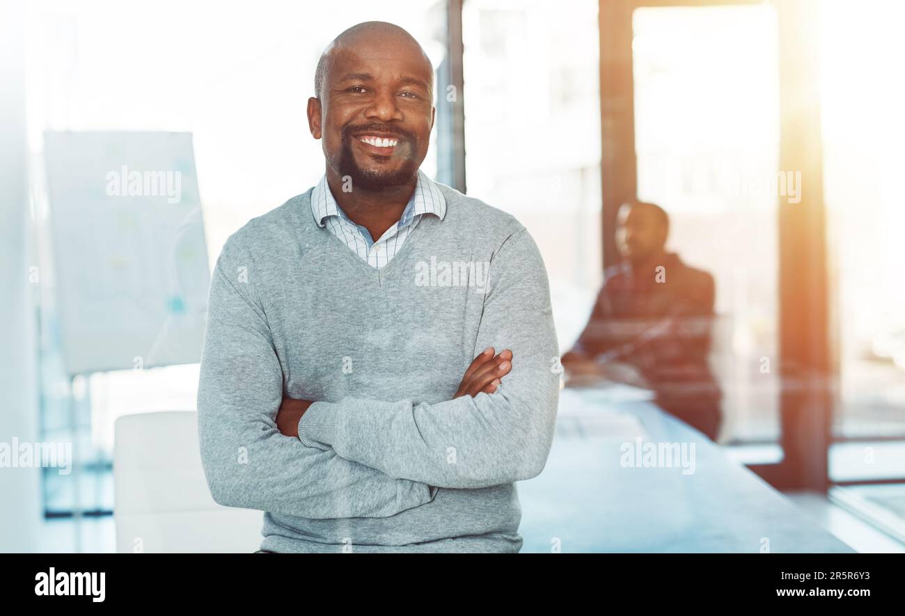 What you do today can improve all your tomorrows. a businessman posing ...
