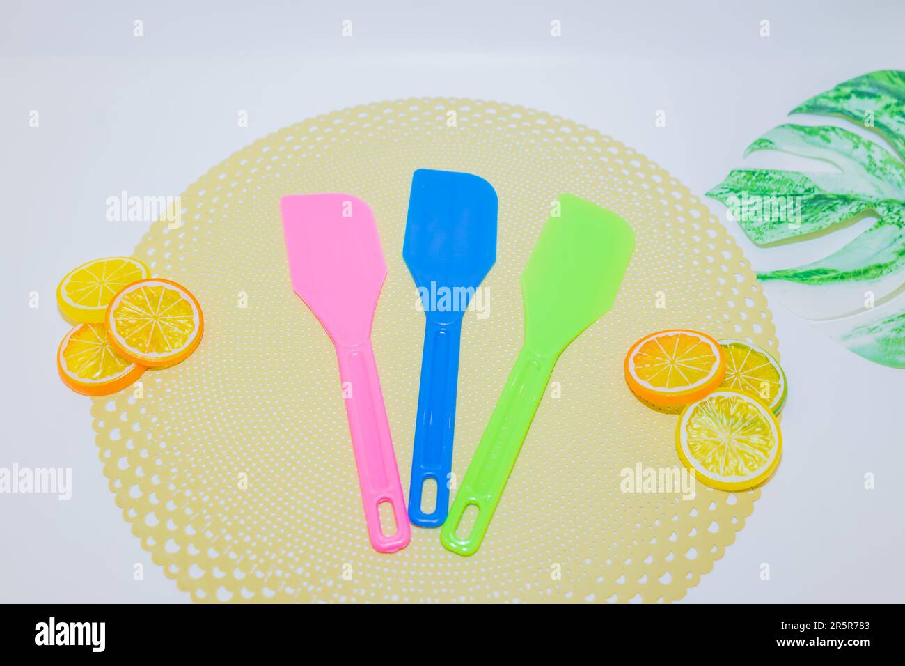 The Colorful Plastic Spatula Set includes spatulas in vibrant shades of ...