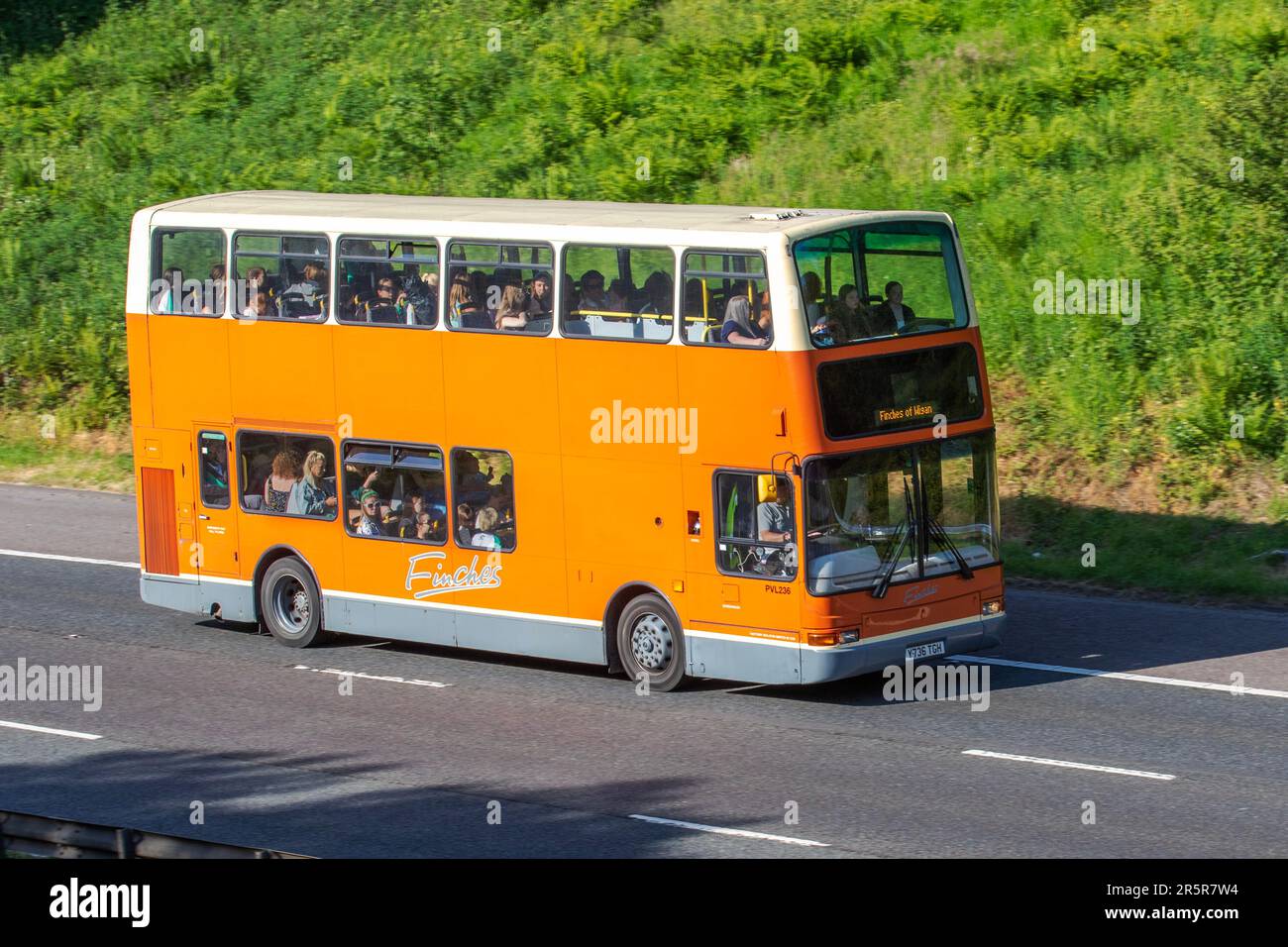 Finches of Wigan, Orange 2001 Volvo B Series double-decker bus full of ...