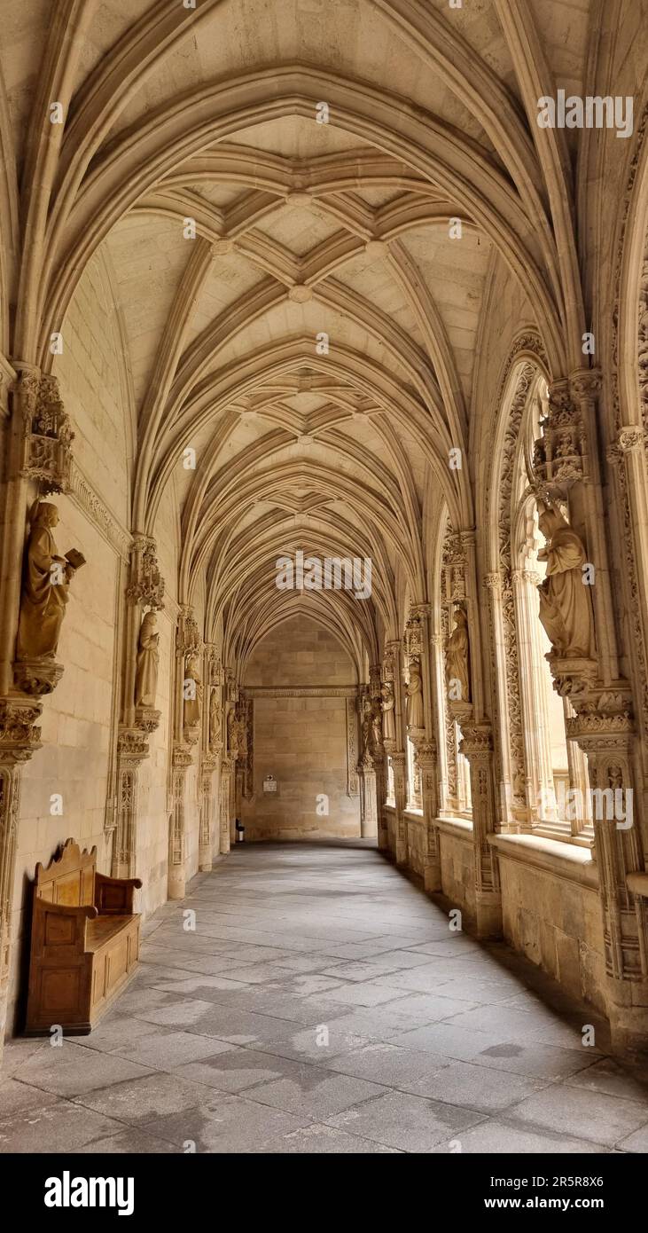 A corridor with medieval windows inside a Spanish cathedral in Toledo ...
