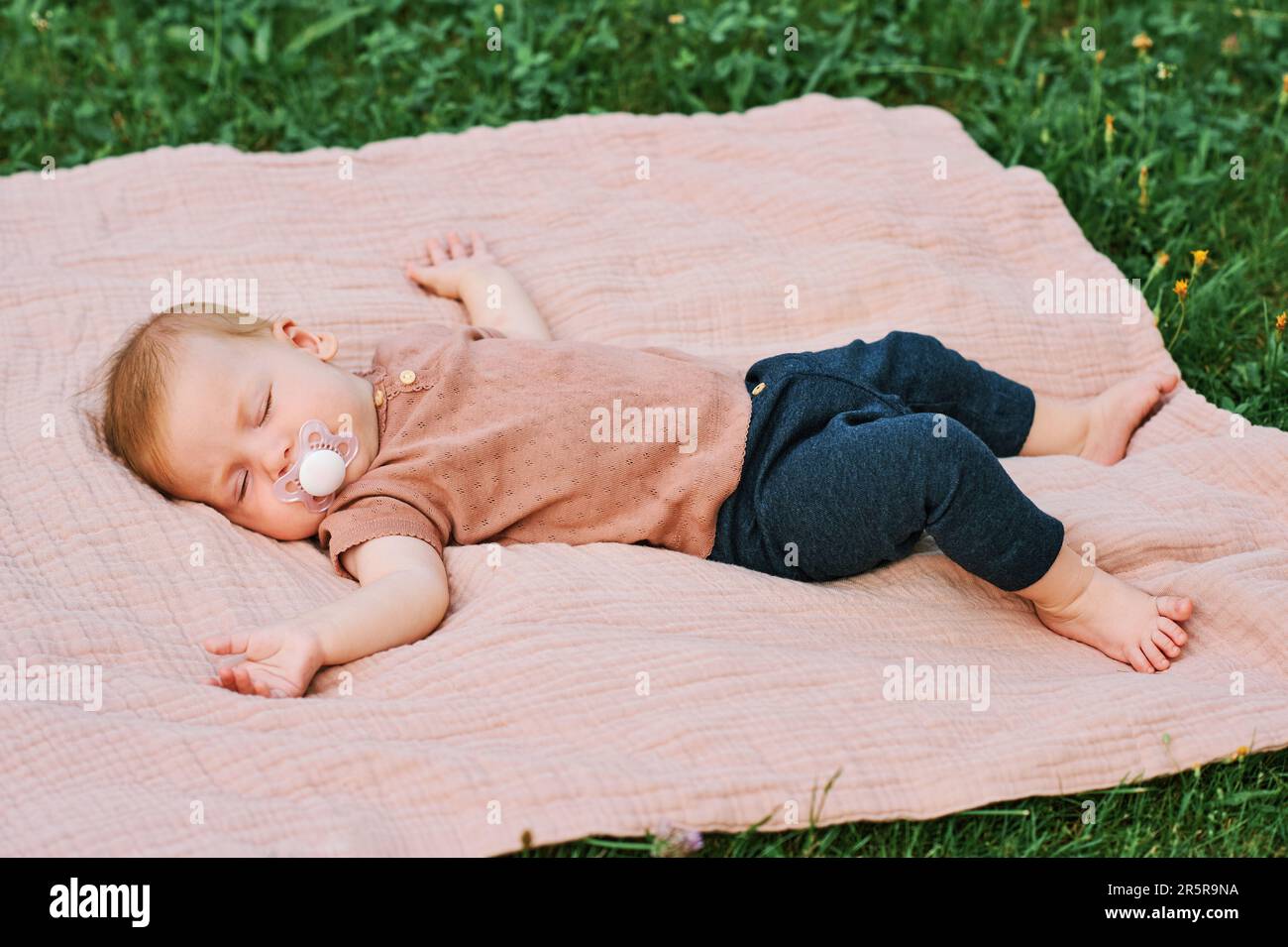Little girl sleeping in park hi-res stock photography and images - Alamy