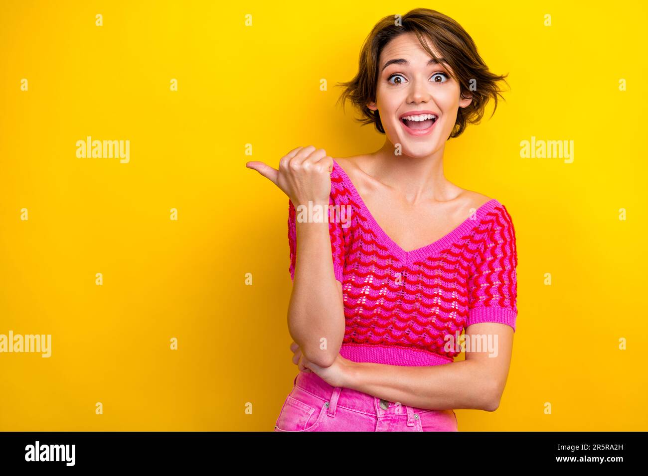 Portrait of ecstatic woman with short haircut wear pink knit top ...