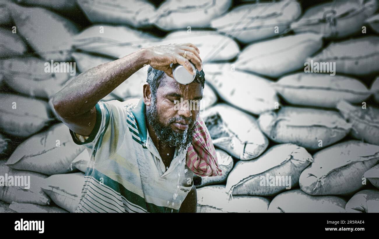 Man pours water from a bottle over his head and faces outdoors on a ...