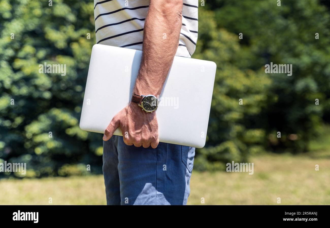 Time saving and portability concept, male person with watch on his ...