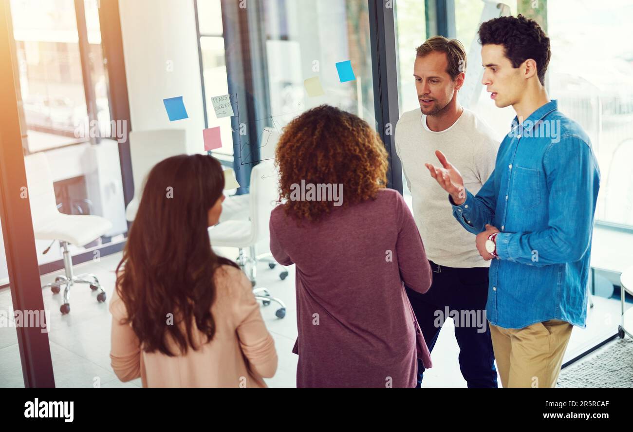 Addressing their ideas together. a group of young designers ...