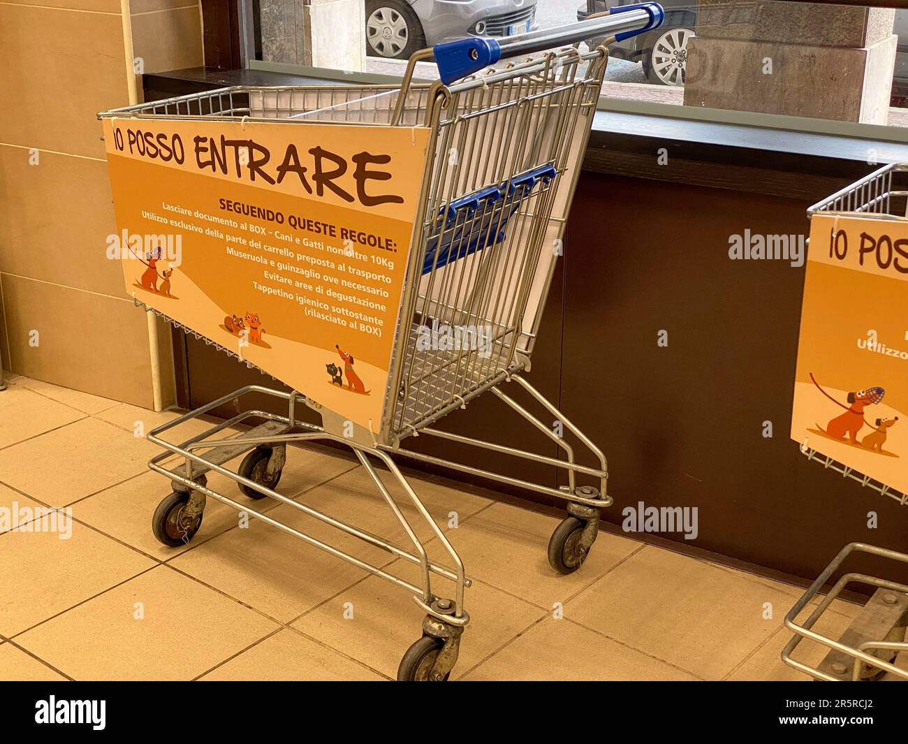 Cremona, Italy - May 2023 At the Conad supermarked grocery carts for ...
