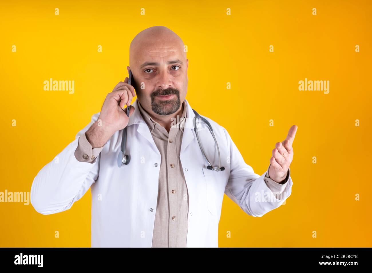 middle aged caucasian angry doctor on the phone. Portrait of middle ...