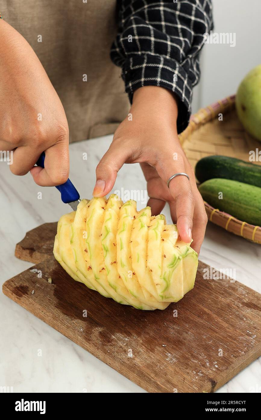 Woman Hand Cut Pineapple in the Kitchen, Process making Tropical Fruit ...
