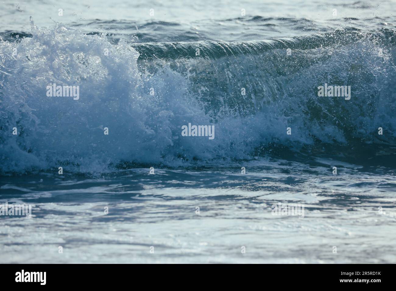 The waves rolling in the ocean with small waves on it Stock Photo - Alamy