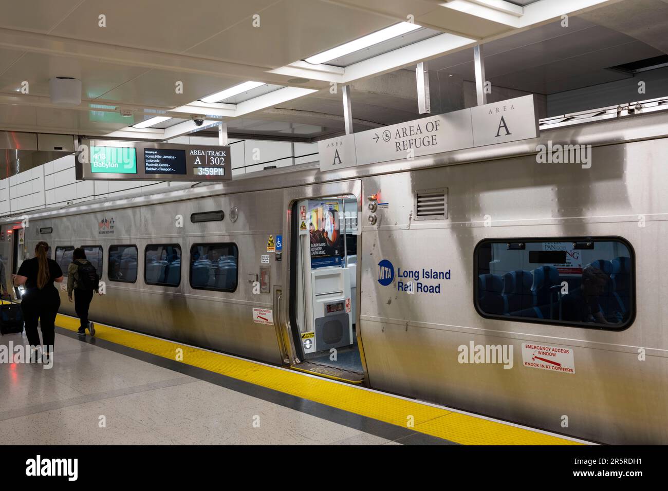 June 4, 2023, New York, New York, United States: Commuters board a ...