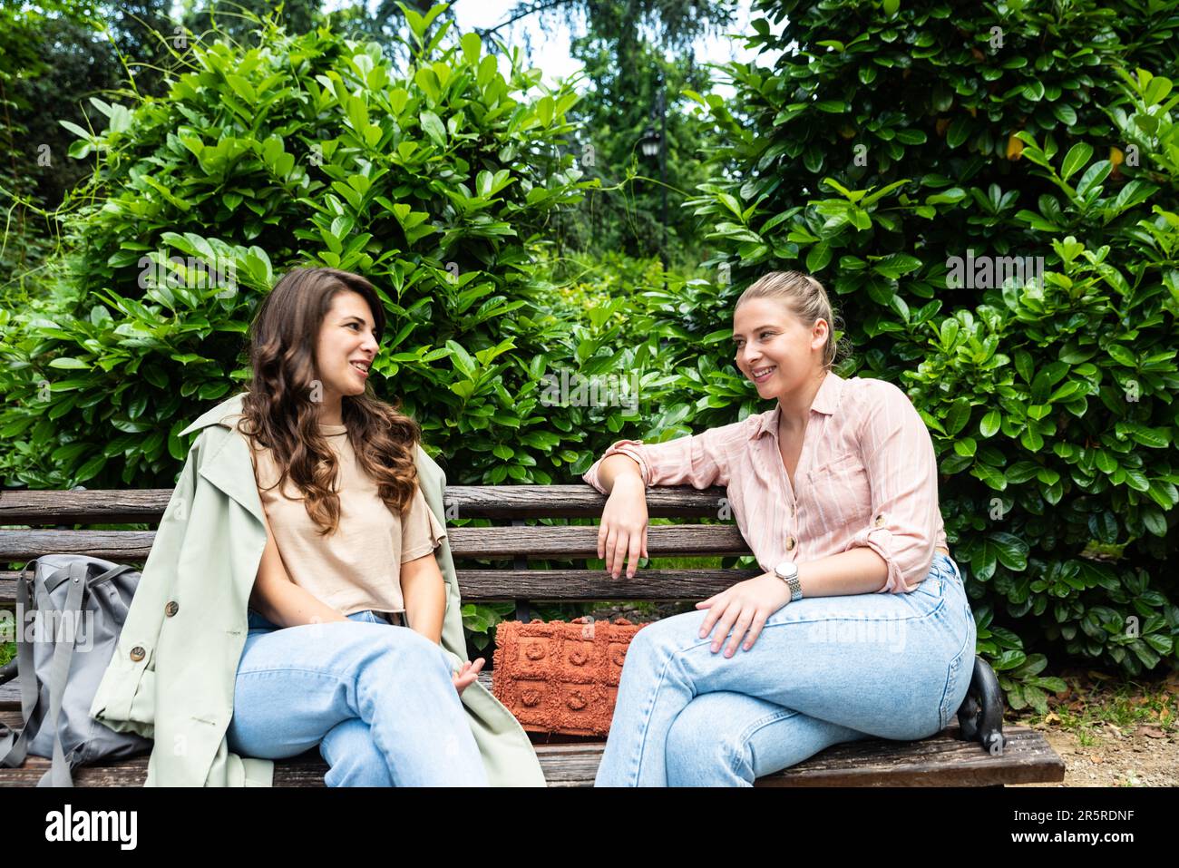Two people talking outside bench hi-res stock photography and images ...