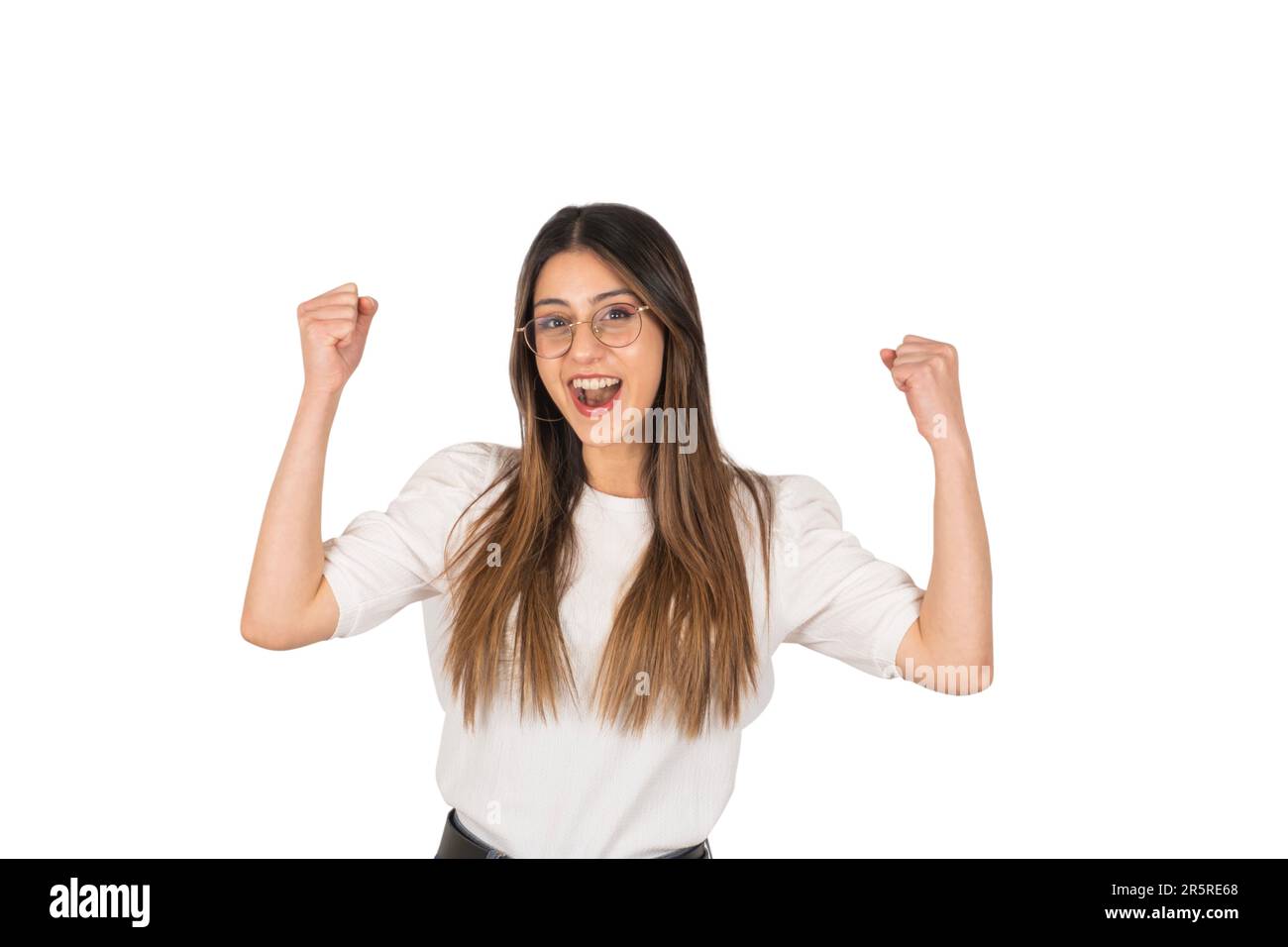 Clenching fists, happy excited young 20s years old girl clenching fists ...