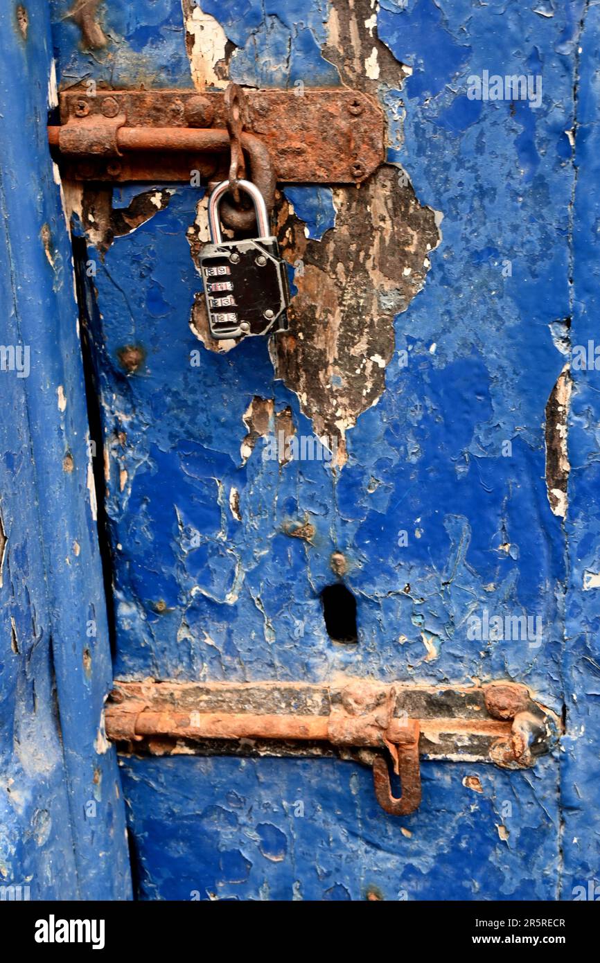 rusted bolts of blue panted door Stock Photo - Alamy