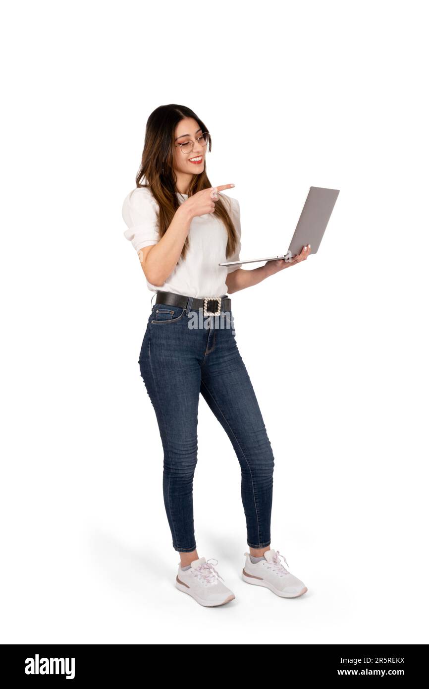 Woman pointing laptop, full body studio shot of beautiful woman pointing laptop. Standing over ...