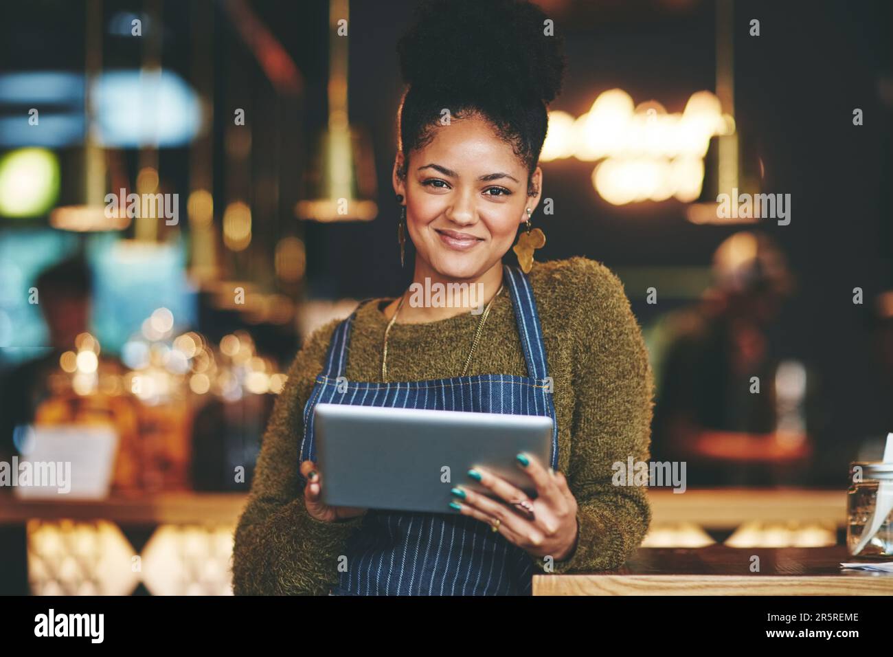 Smart technology makes coffee shop management so much easier. a young ...
