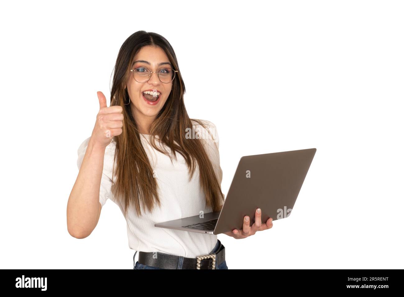 Woman holding laptop. Newest notebook in her hand, showing thumb up ...