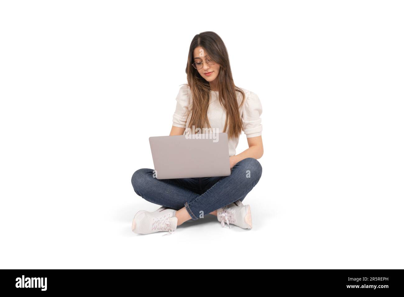 Woman sitting on ground with laptop. Female office worker. Full body ...