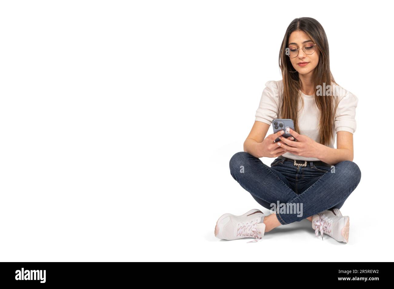 Using smartphone, confident serious caucasian girl using smartphone ...