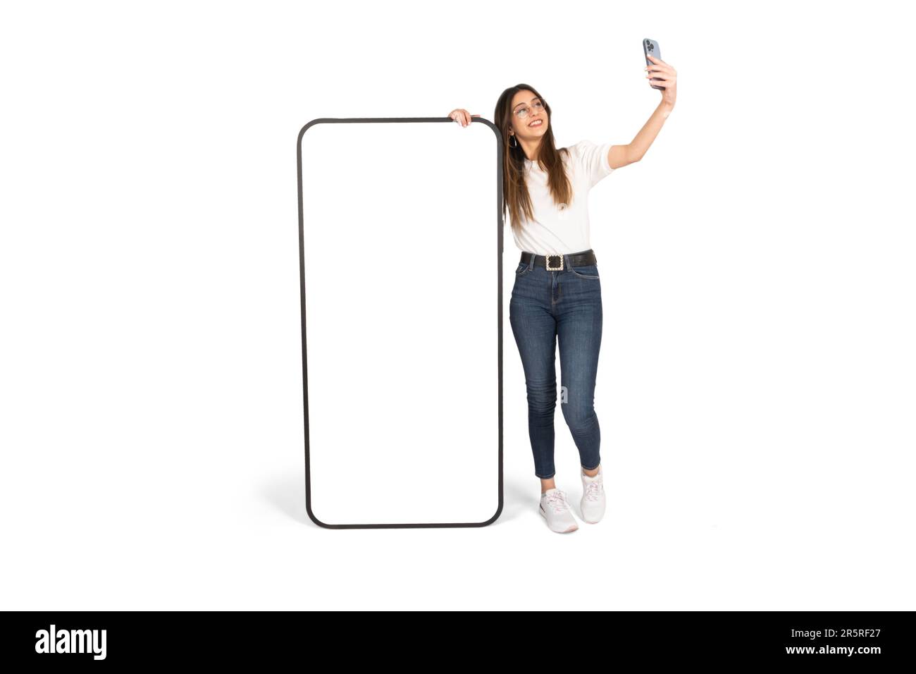 woman leaning on big smartphone and taking selfie. Full body size view ... woman leaning on big smartphone and taking selfie. Full body size view ...