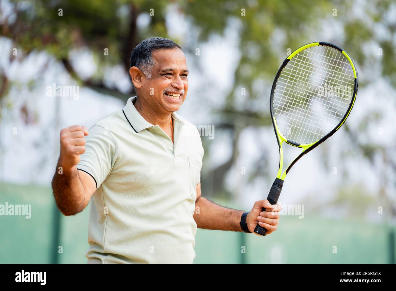 Angry indian senior men after losing the game while playing tennis at ...