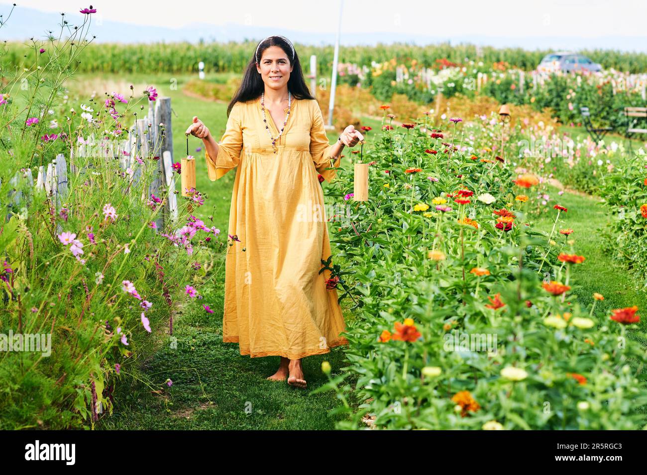 Spiritual woman performing guided meditation through music using koshi ...