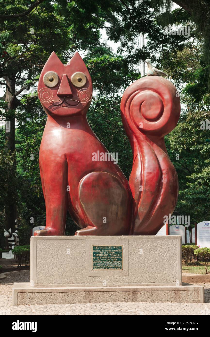 A bronze Hernando Tejada cat sculpture in a park in Santiago de Cali ...