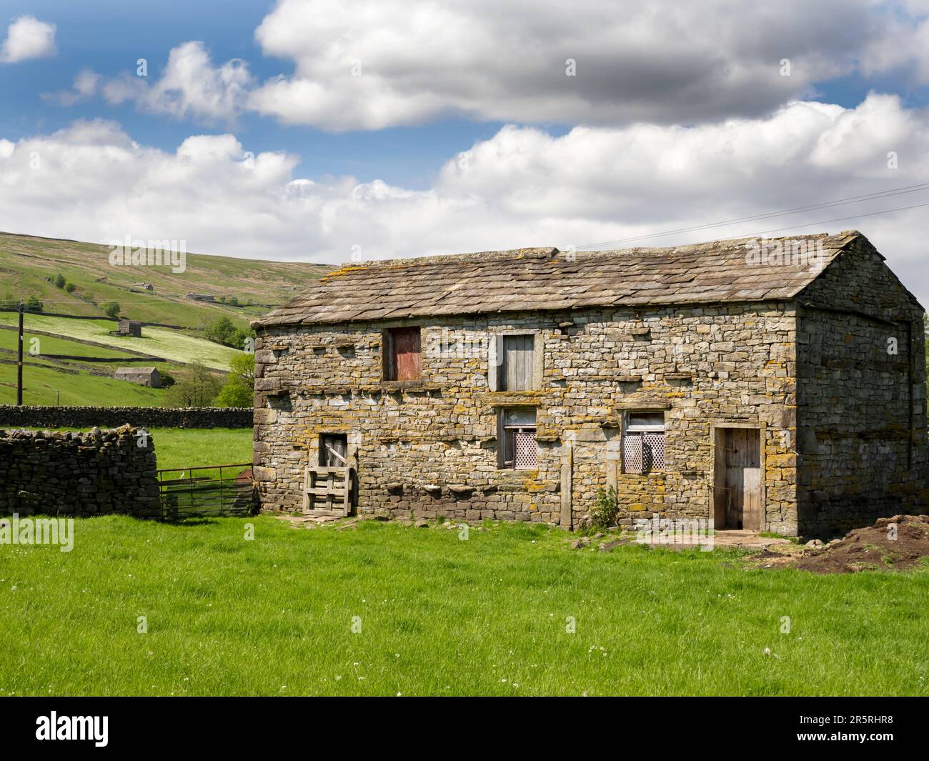 Traditional hay meadows and cow barns near Muker, Swaledale, Yorkshire ...