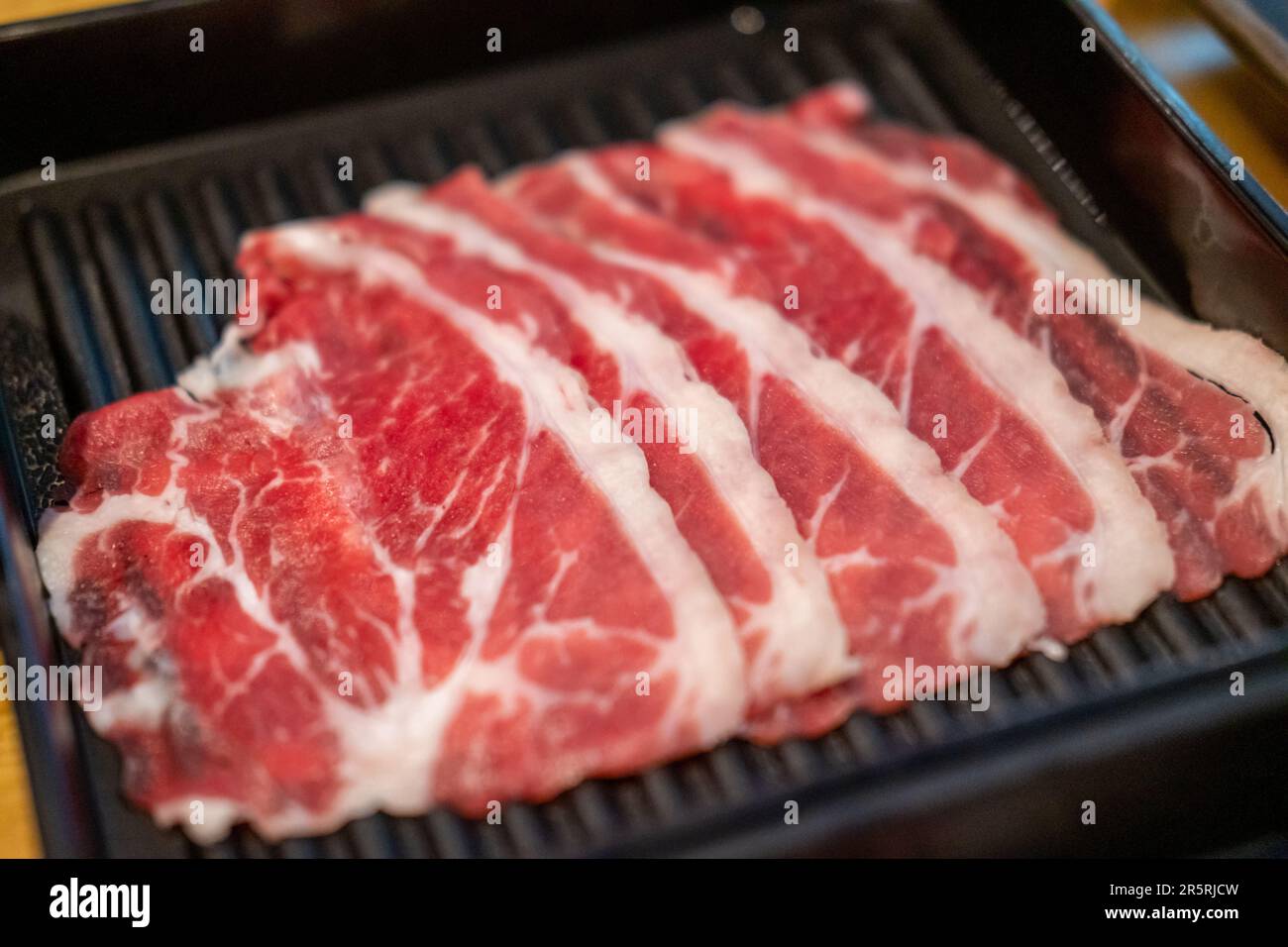 Close up of sliced raw meat, ready to be cooked by hot pot Stock Photo ...