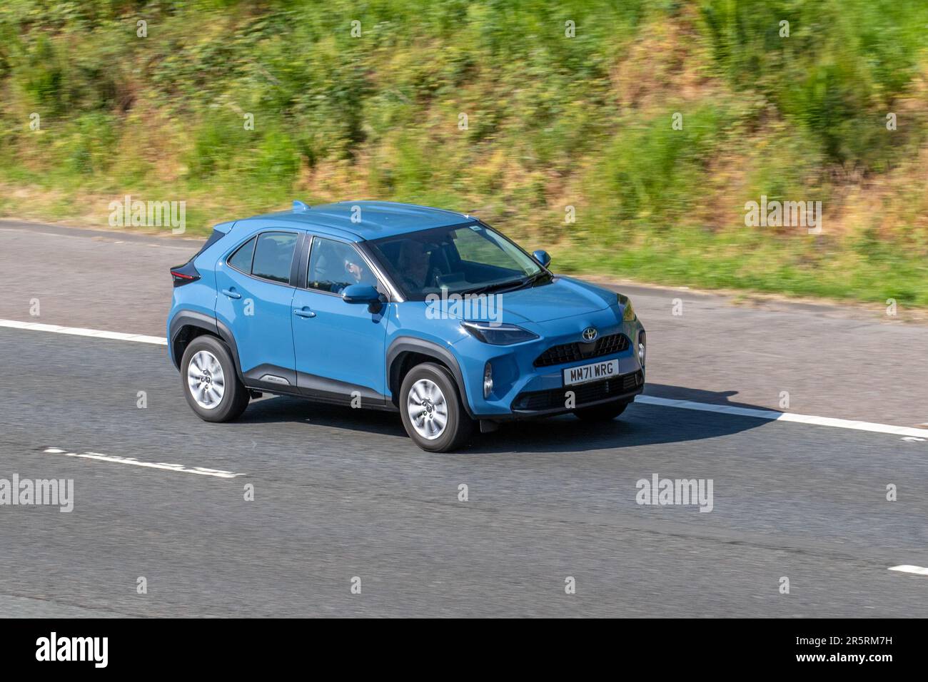2022 Toyota Yaris Cross Icon HEV Auto travelling on the M61 motorway ...