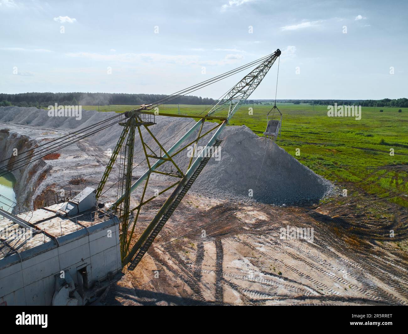 Walking dragline with hoist and bucket works in chalkquarry Stock Photo ...