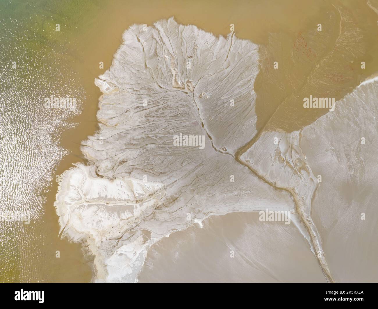 Soaking of salt and sand mixture in illuminated brine traps Stock Photo ...