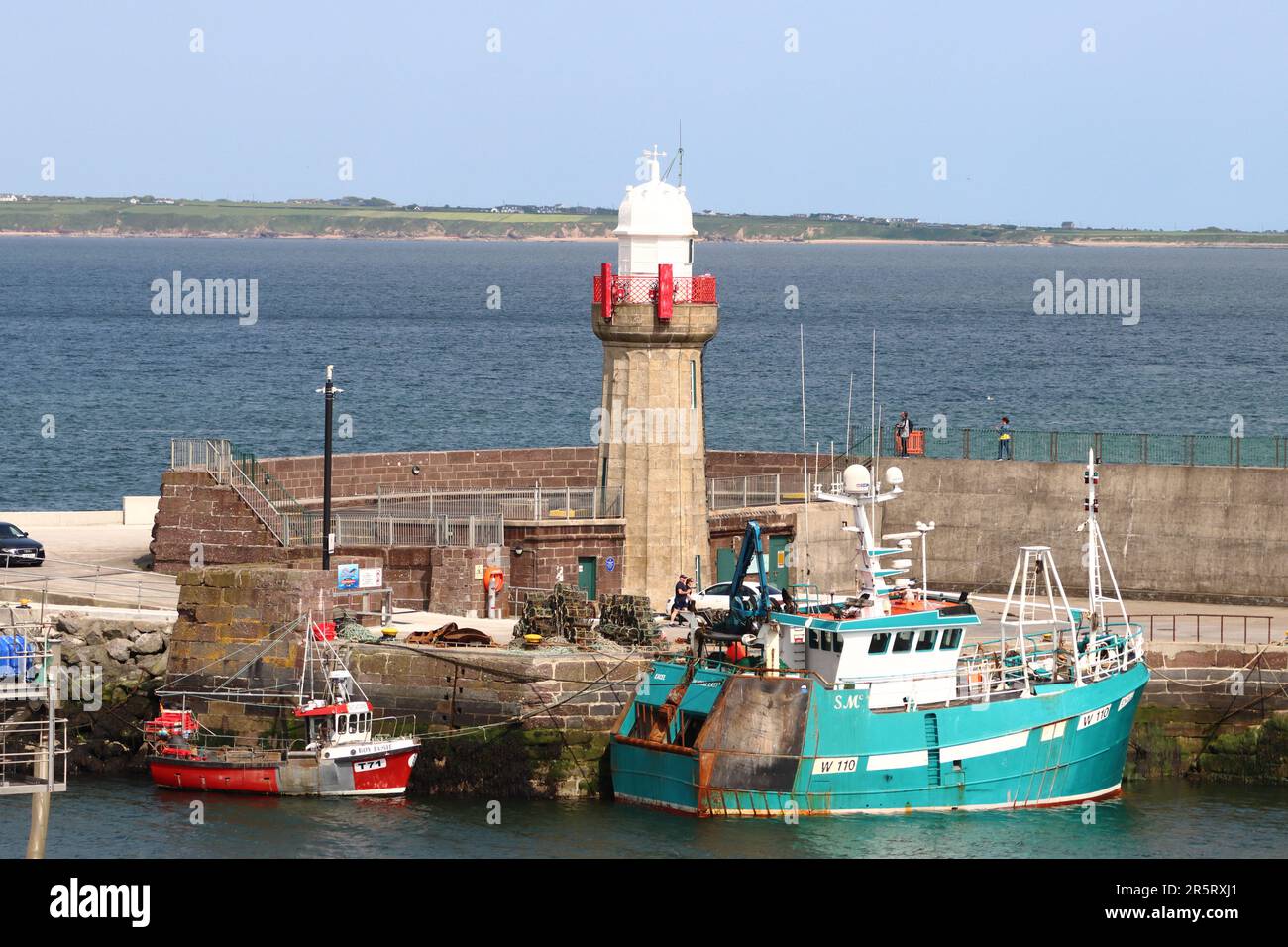 Fishing vessels in the harbour at Dunmore East, County Waterford, Ireland Stock Photo - Alamy