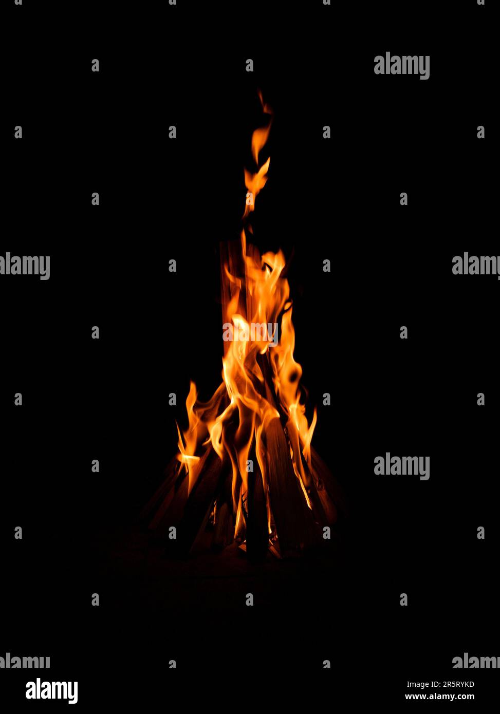 playing tongues and reflections of flame on a black background Stock ...