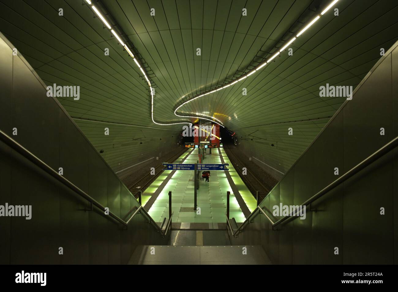 The inside of an escalator, showcasing the illuminated staircase and ...