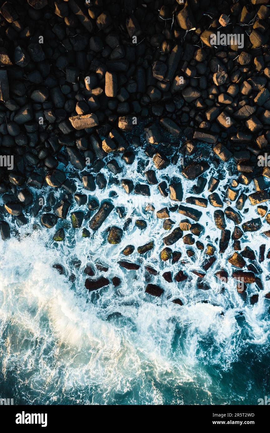 An aerial photograph of a rocky coastline, taken from a helicopter ...