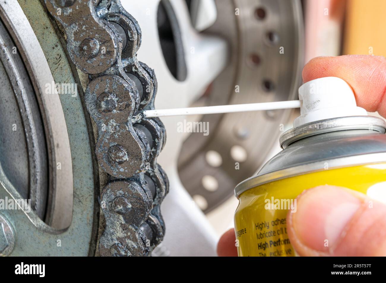 Motorcycle drive chain close up, and grease spray lubricant Stock Photo ...