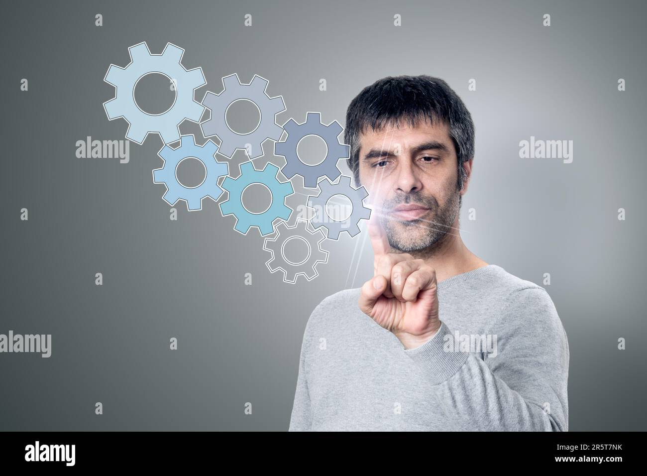 Man with sprocket mechanism Stock Photo - Alamy