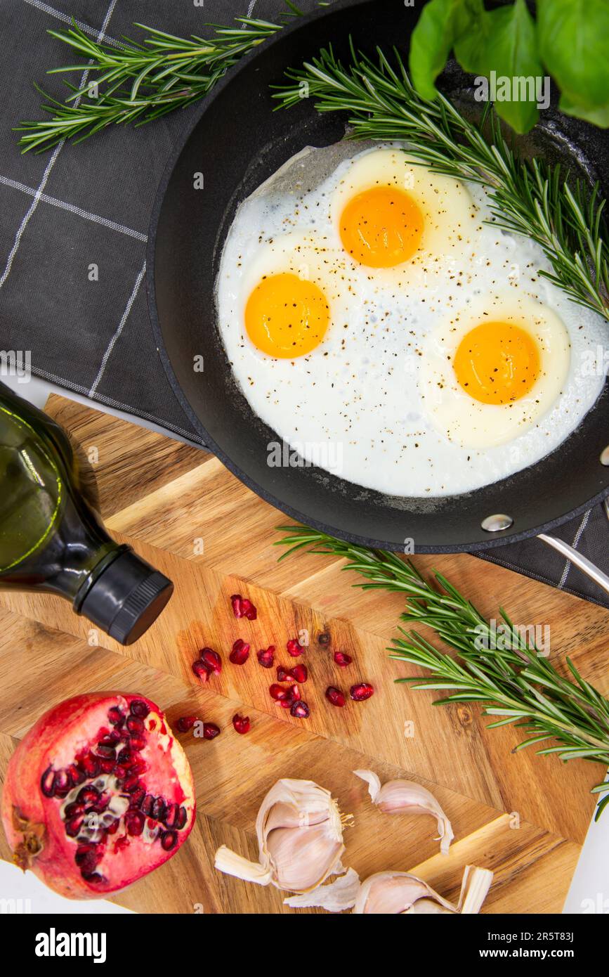 A top-down view of a kitchen table with various food items arranged on ...