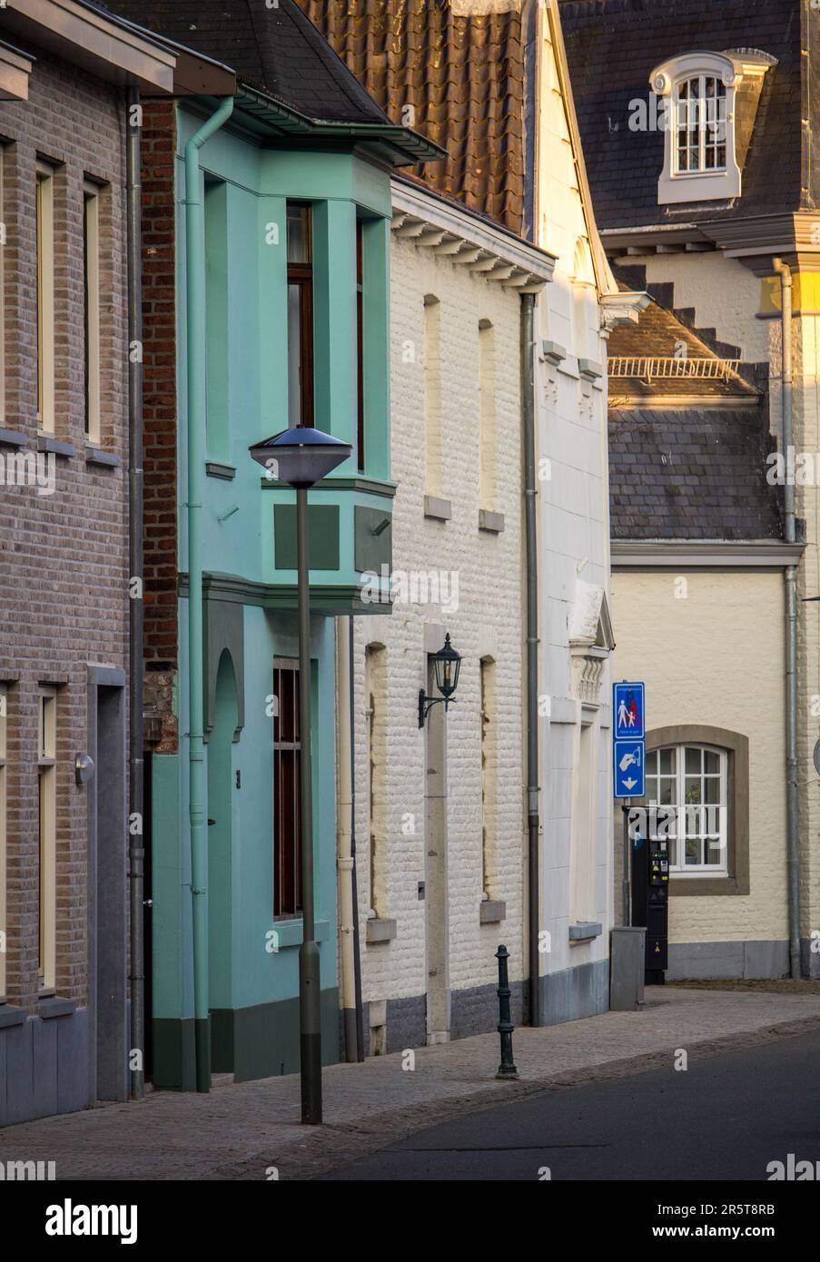 A scenic street in a bustling city, featuring quaint buildings with ...