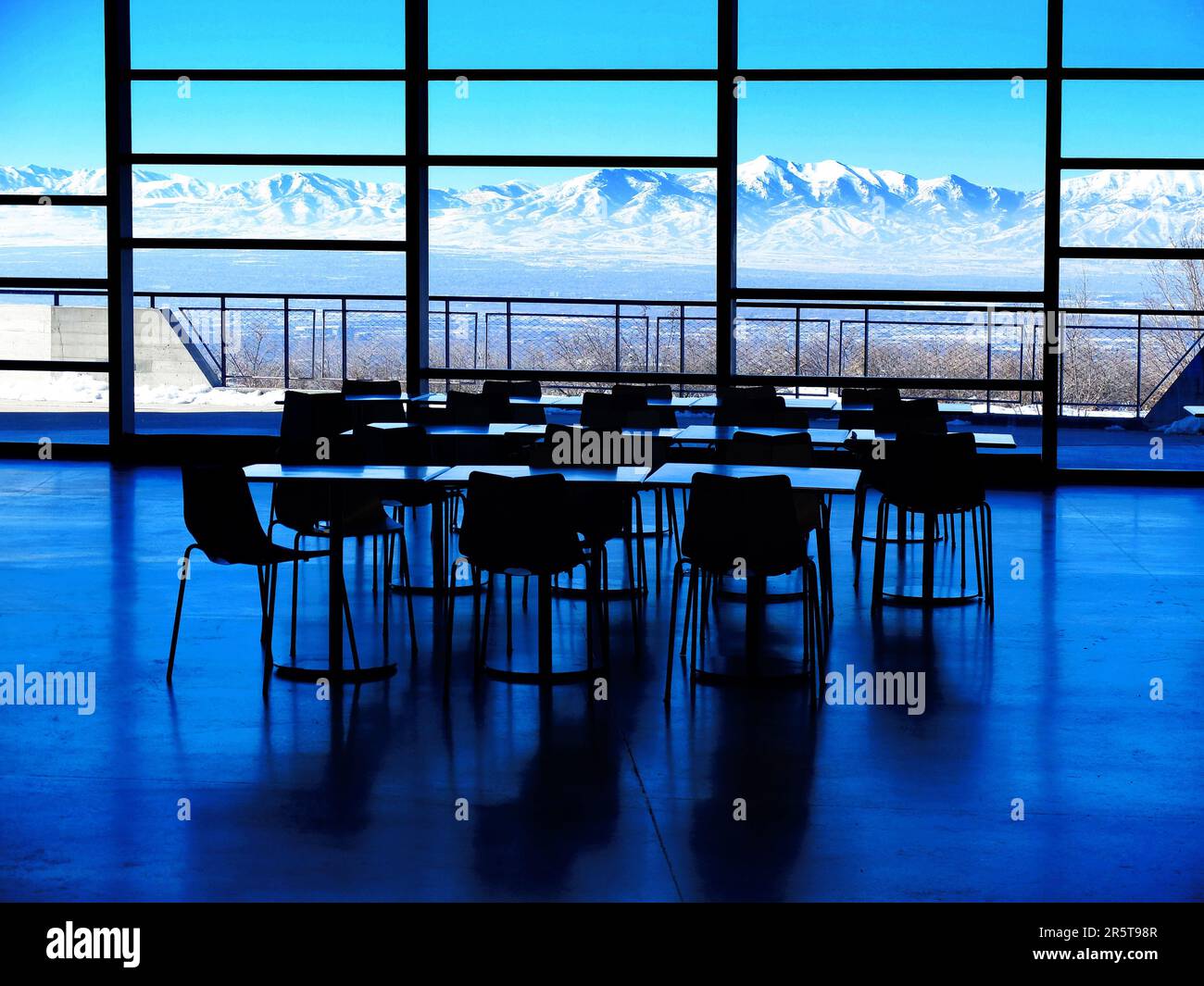 Empty cafeteria or meeting room with tables and chairs and a window ...