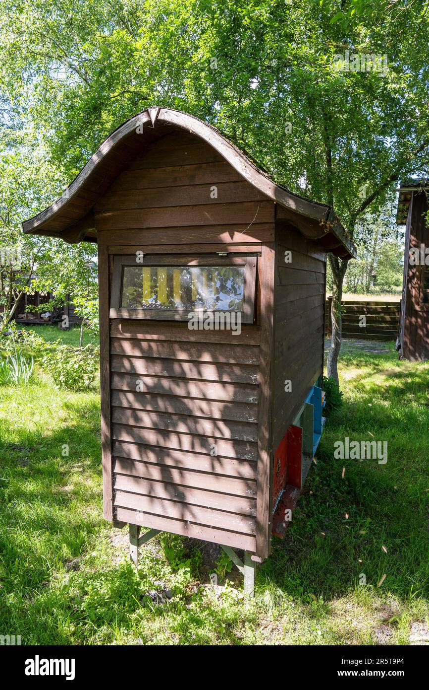 Set of wooden beehive in the spring garden, close up. Large wooden bee ...