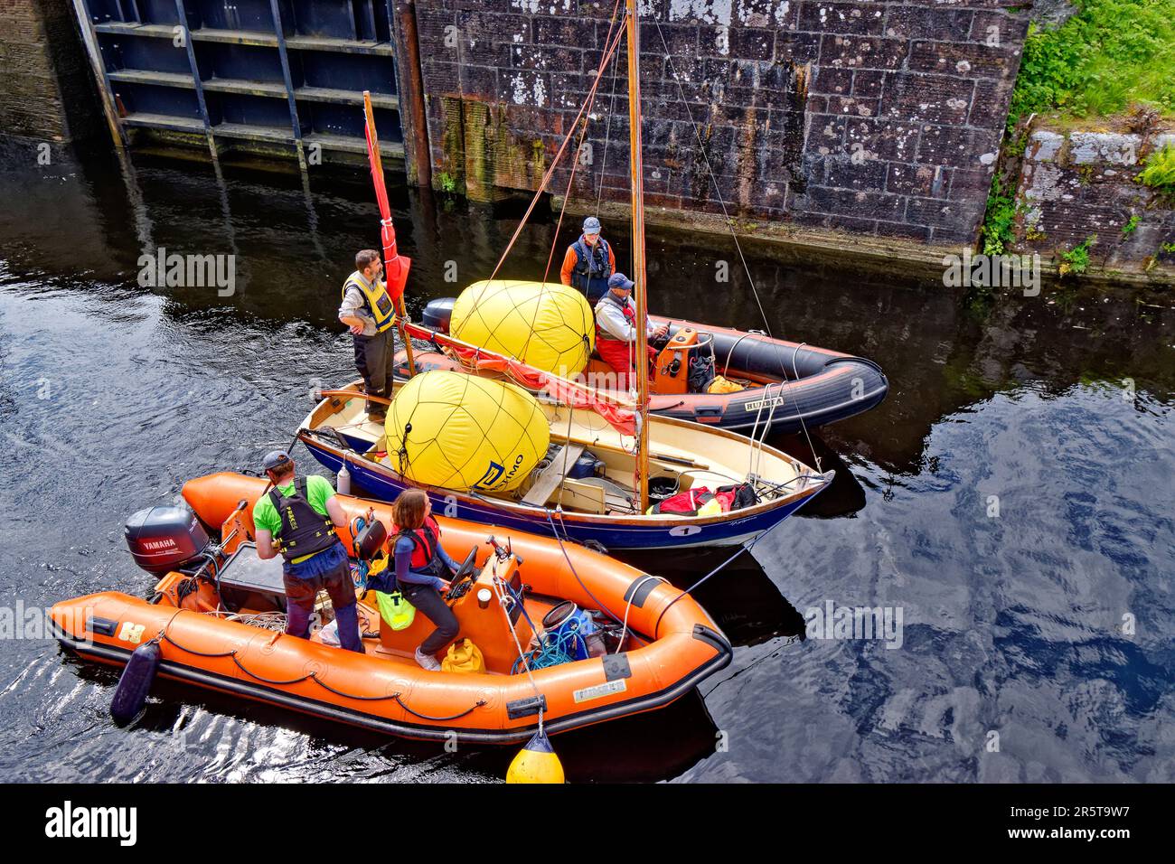 Inverness Scotland colourful inflatable boats in early summer leaving ...